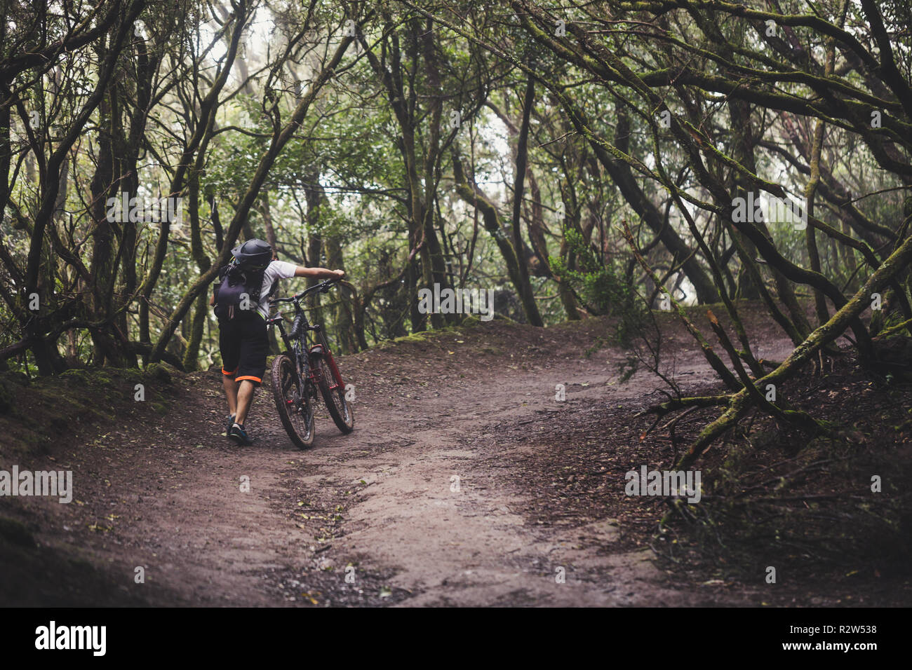 Bike in rain hi-res stock photography and images - Alamy