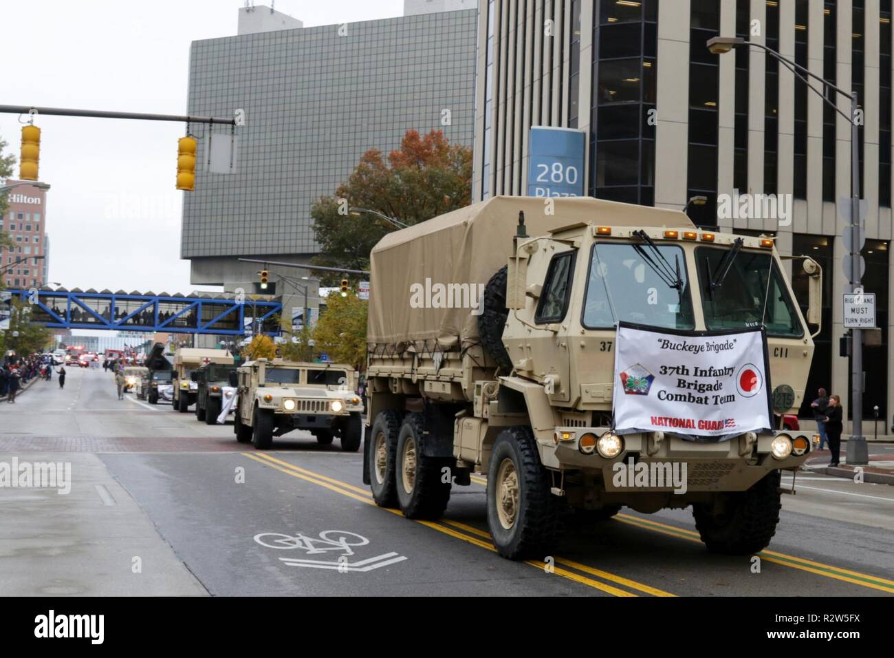 Ohio Army National Guard vehicles roll down the street as part of the ...