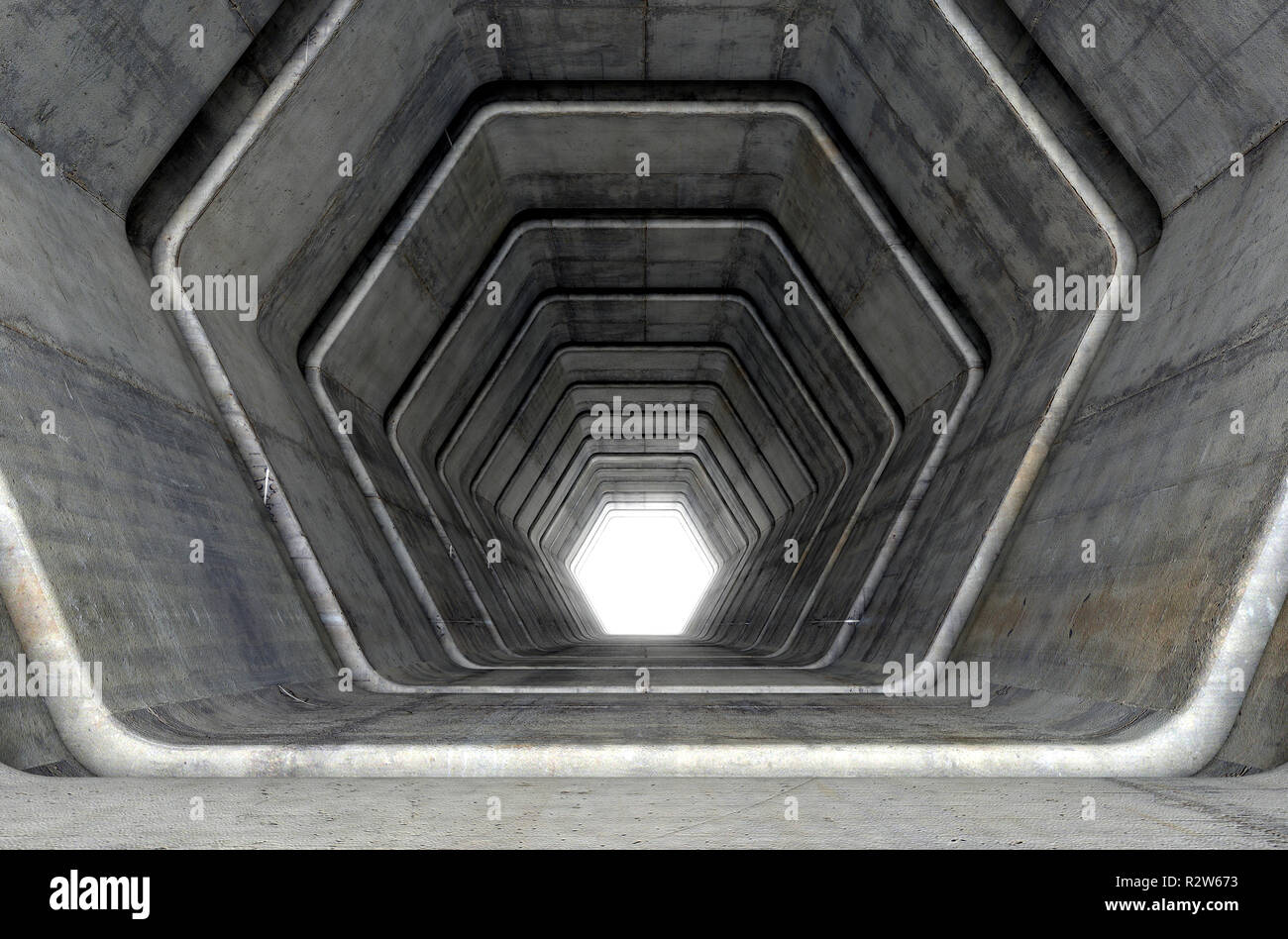 A look down a concrete tunnel made out of hexagonal geometric shapes ...