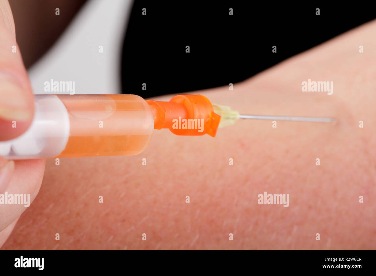 syringe in arm Stock Photo - Alamy