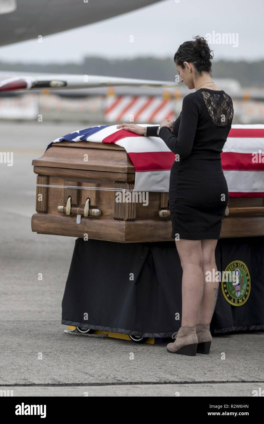 Shawn Slape lays her hand on the flag-draped casket of her husband Sgt ...