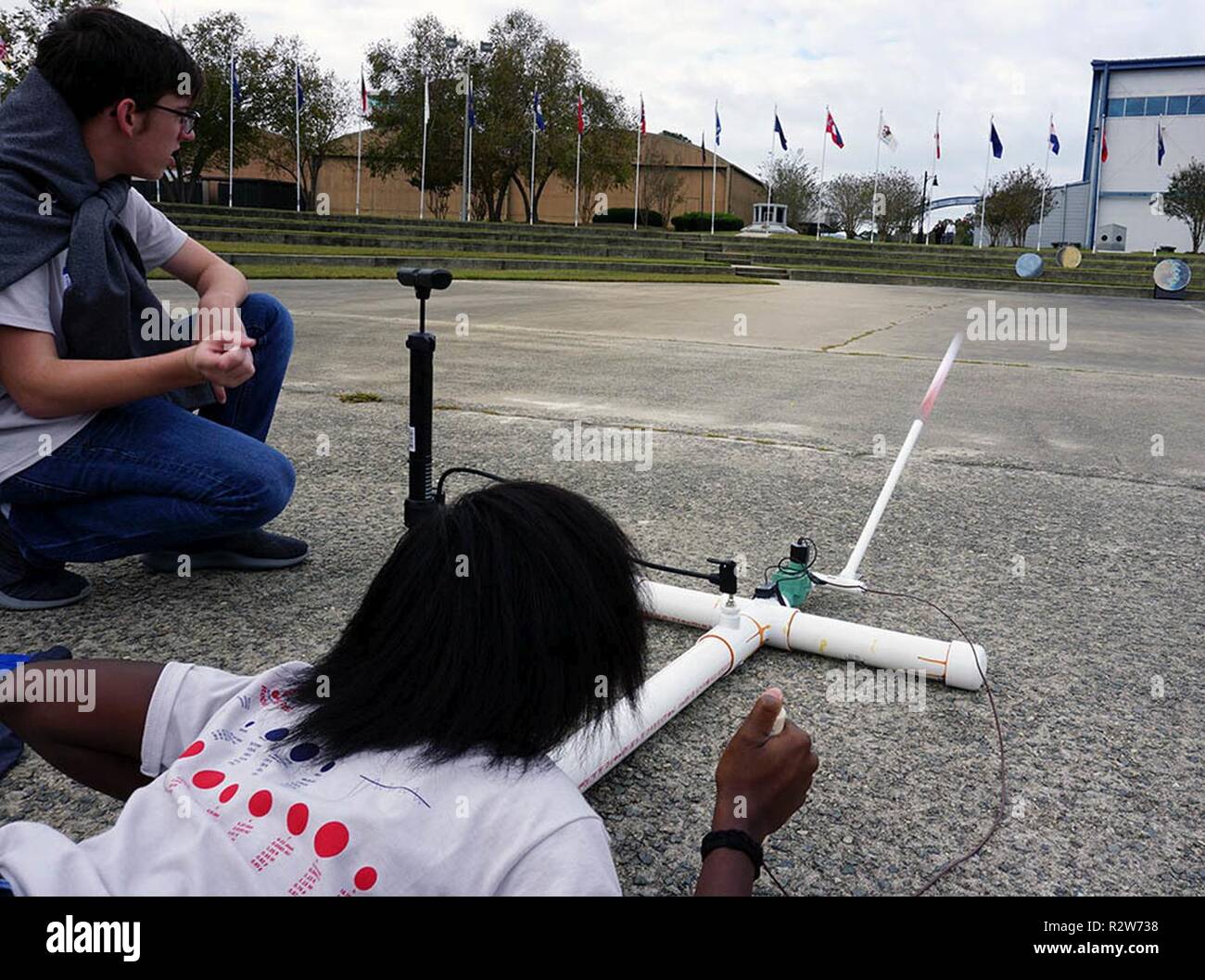 Students launch a paper rocket at a Science, Technology, Engineering ...