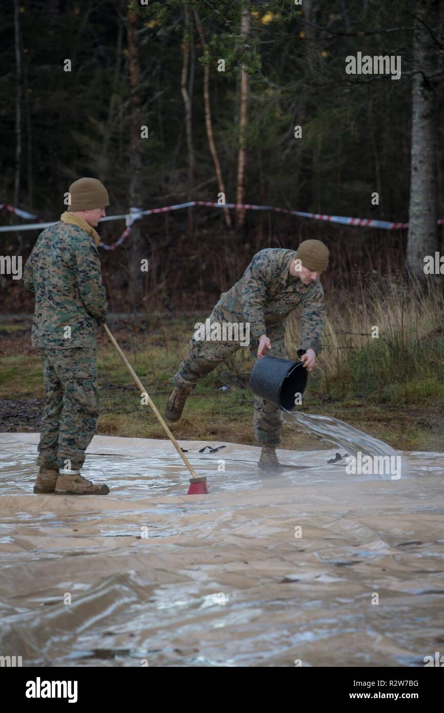 U.S. Marine Corps Cpl. Zachary Sweeney, left, with 8th Engineer Support ...