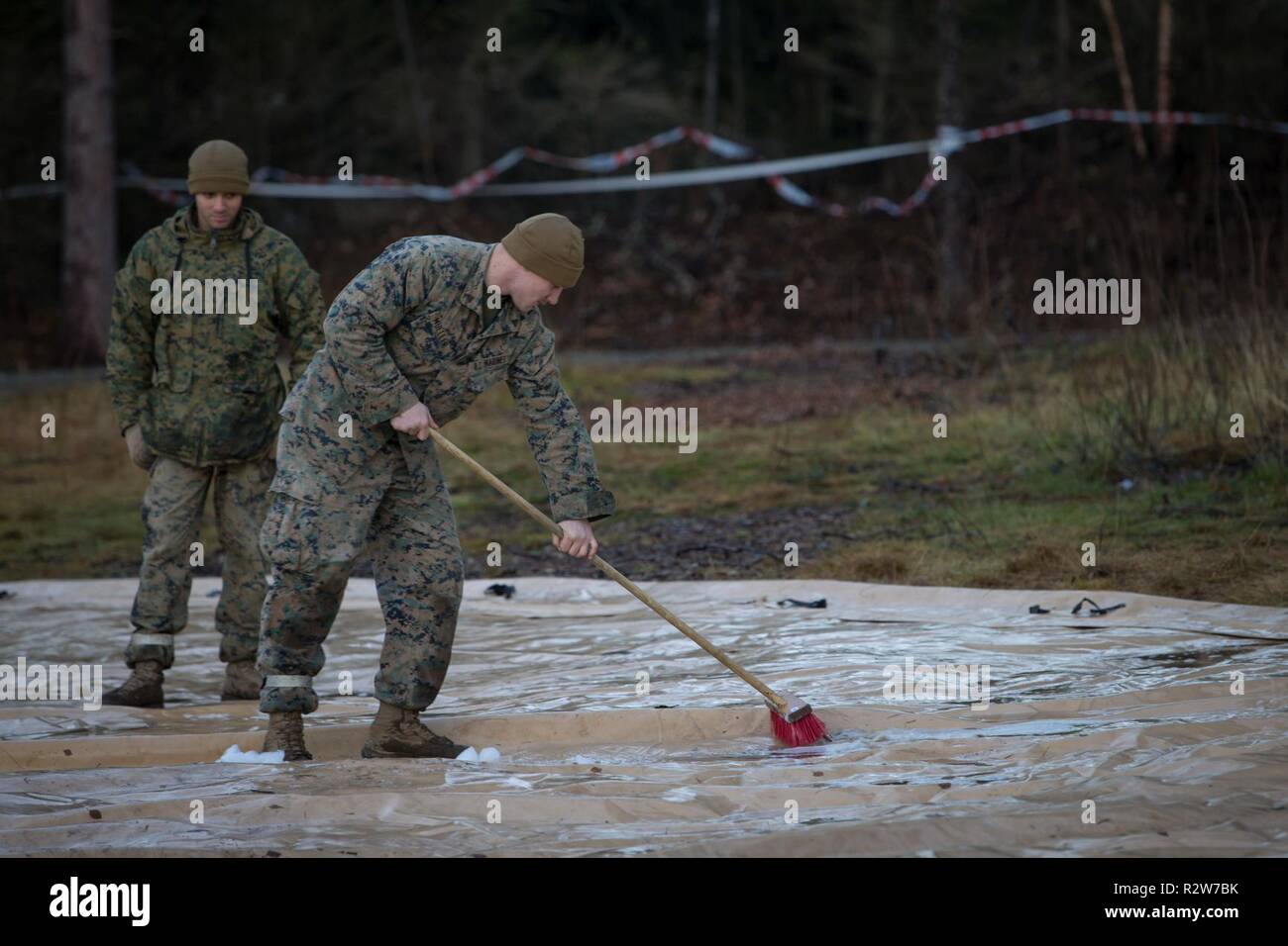 U.S. Marine Corps Cpl. Joshua Mueller, center, with 8th Engineer ...