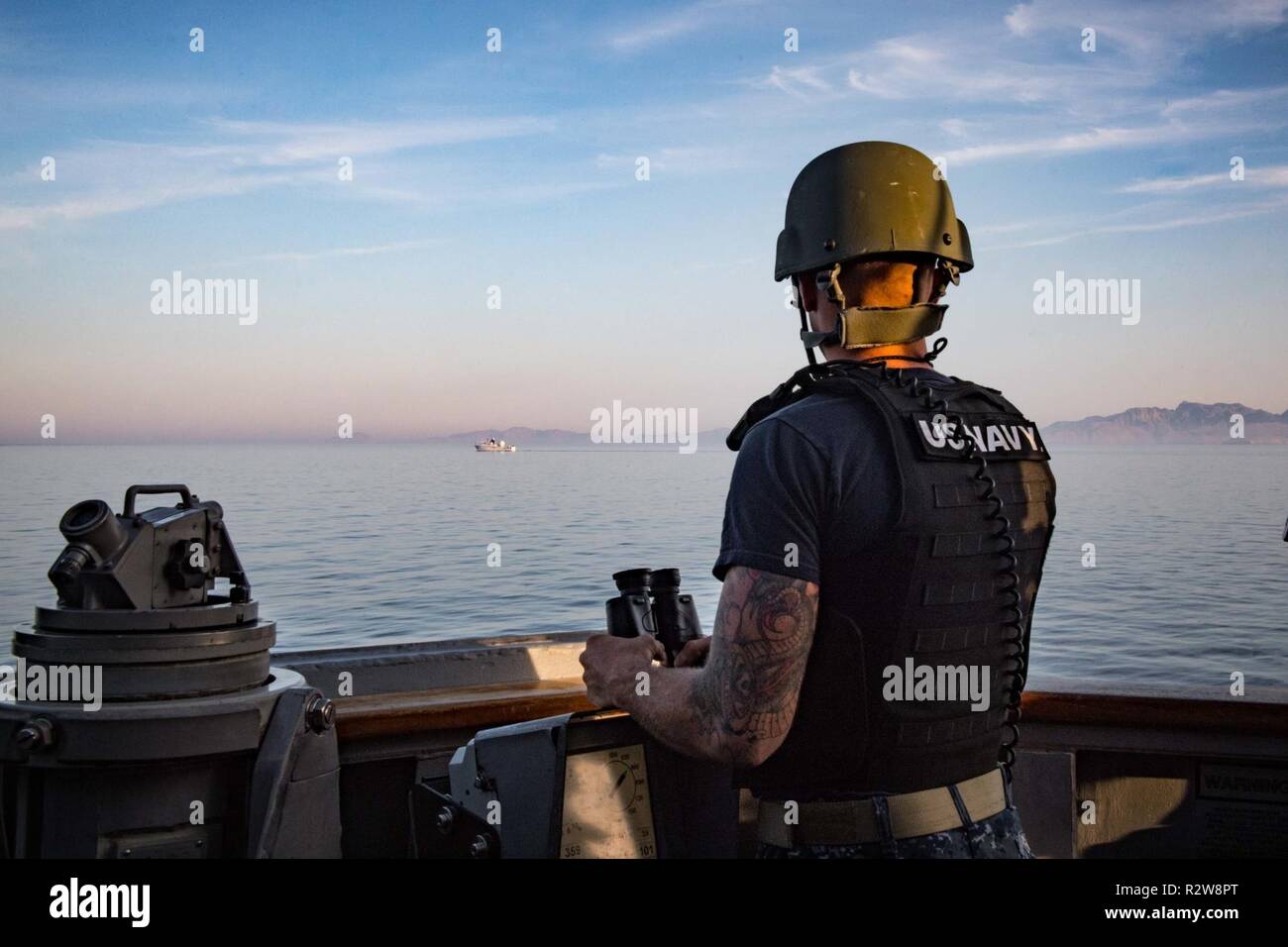 STRAIT OF HORMUZ (Nov. 14, 2018) Ensign Bryson Goforth stands watch on ...
