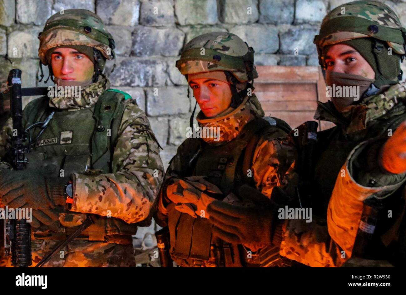 Georgian Army soldiers with the 32nd Infantry Battalion keep warm next ...