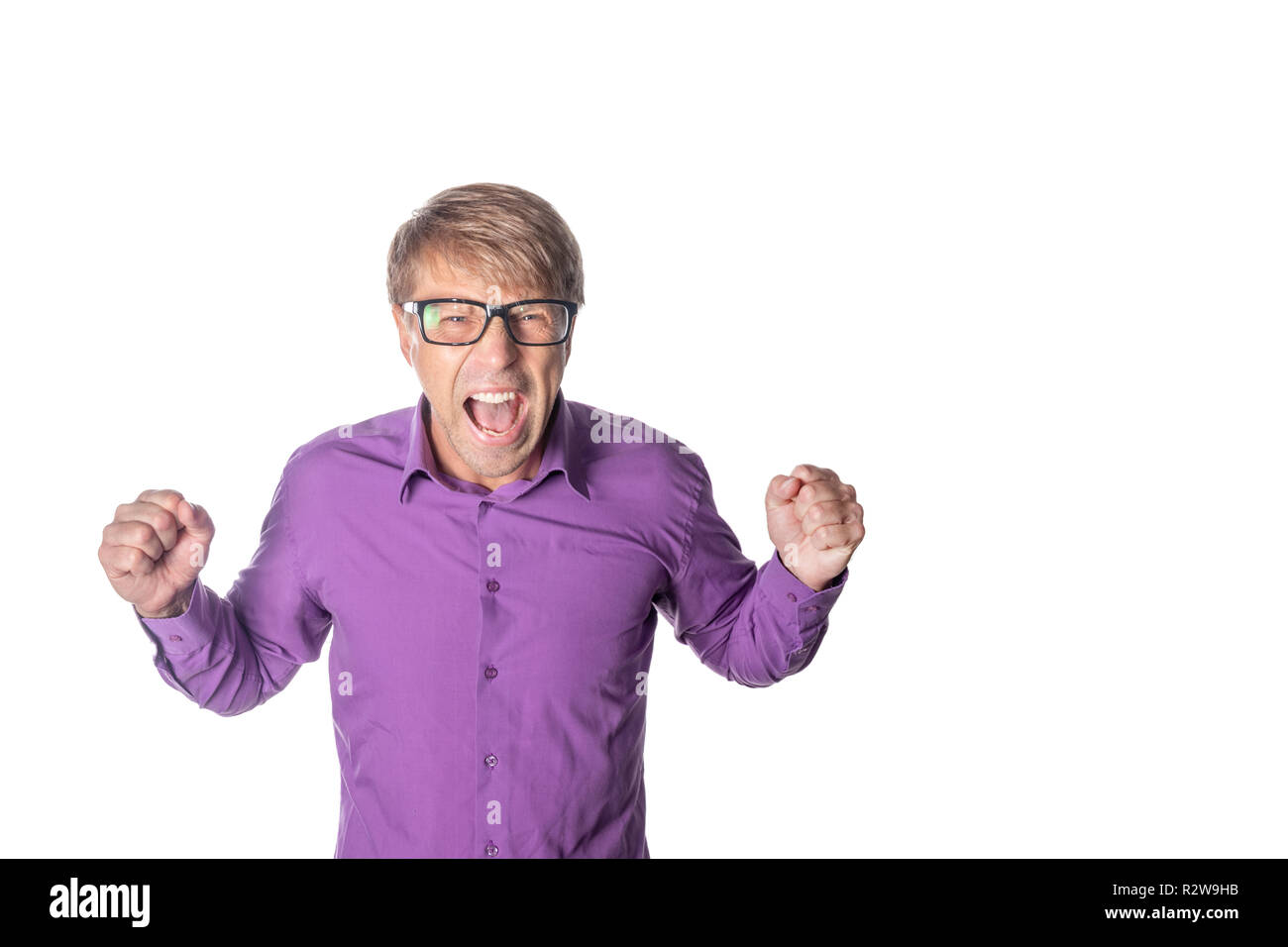 Portrait of a angry man with glasses staring at camera, and shouting ...