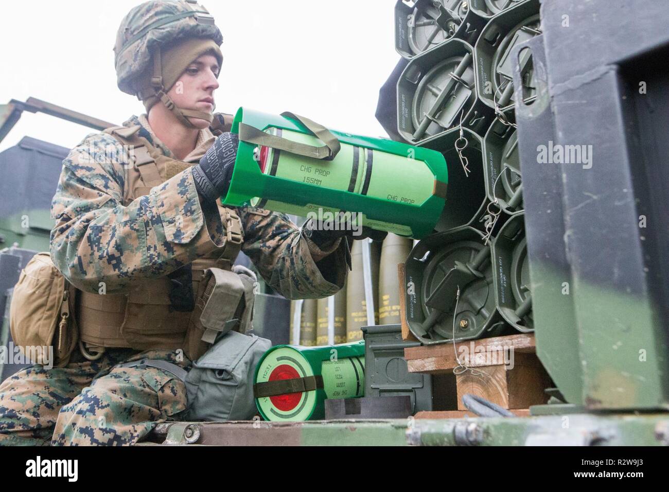 A U.S. Marine with 1st Battalion, 10th Marine Regiment uncases 155mm ...