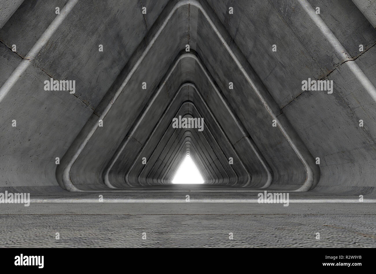 A look down a concrete tunnel made out of triangular geometric shapes ...