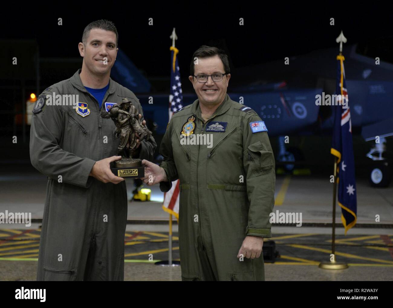 Royal Australian Air Force Air Commodore Michael Kitcher presents a ...