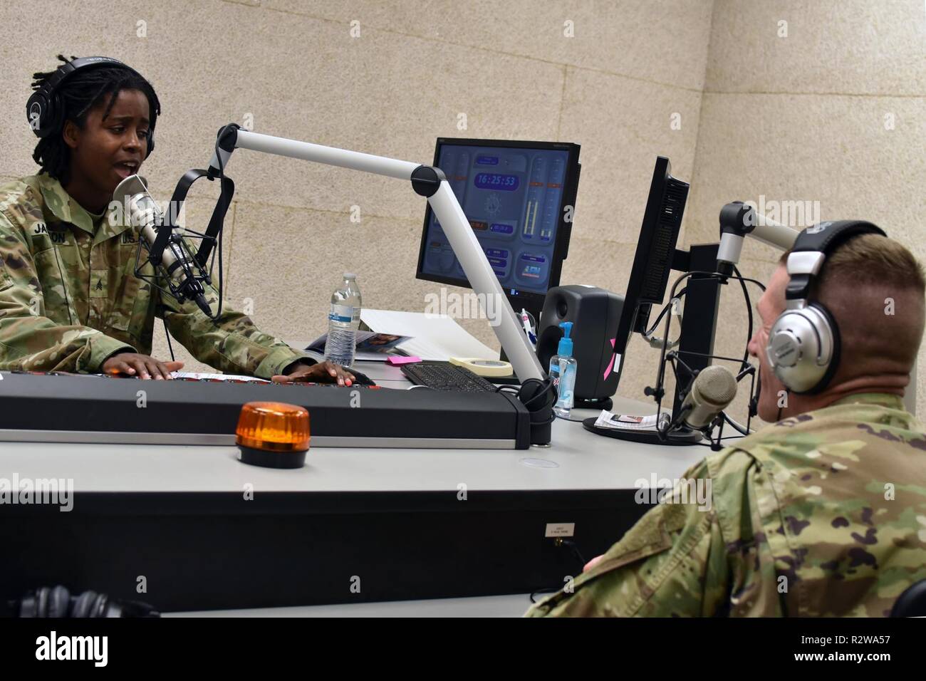 Sgt. Joni Jackson (left), a radio broadcaster, conducts a radio ...