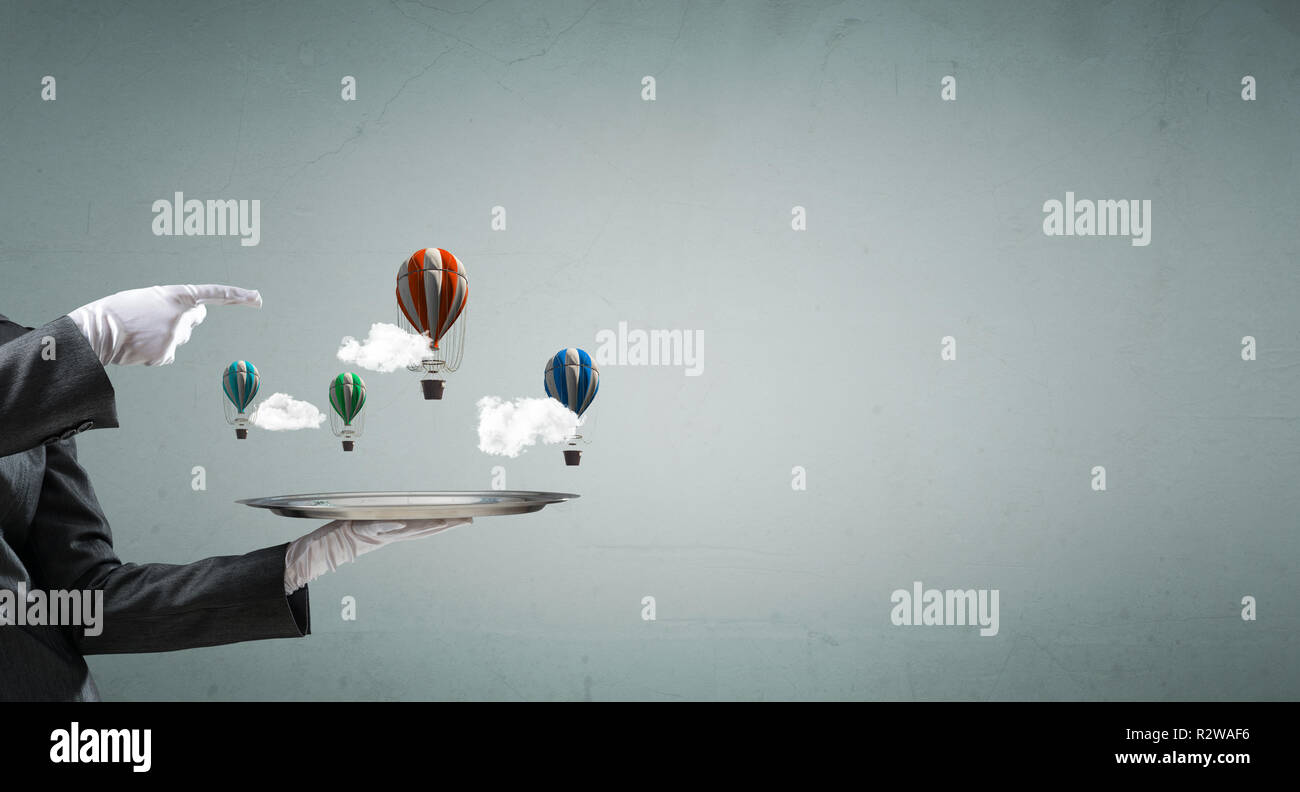 Hand of waitress presenting balloons on tray Stock Photo - Alamy