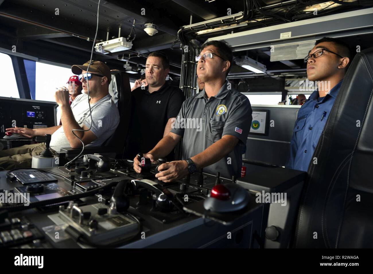 BRUNEI BAY (Nov. 15, 2018) - The bridge team aboard Military Sealift Command’s expeditionary ...