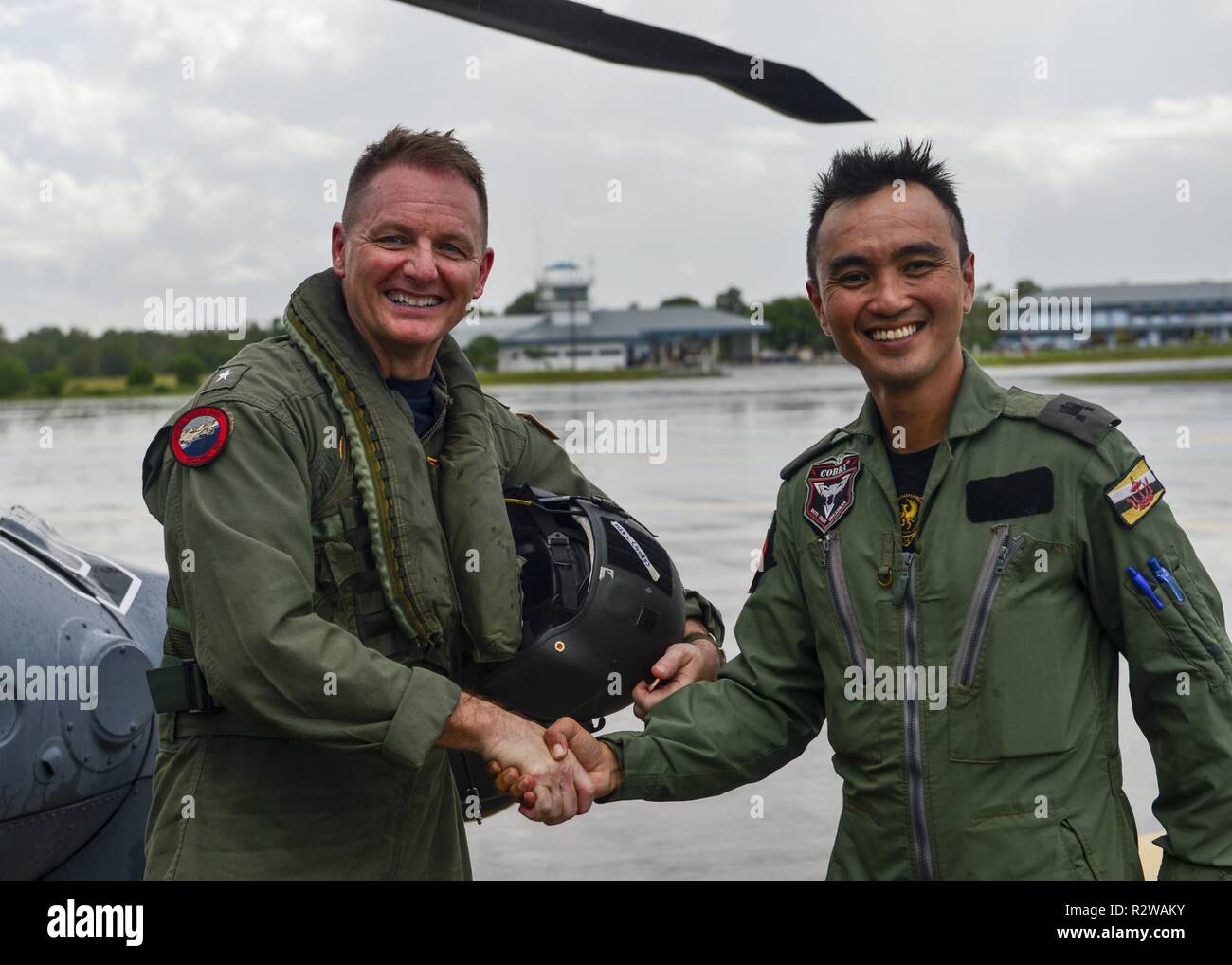 RIMBA AIR BASE, Brunei (Nov. 14, 2018) - Rear Adm. Joey Tynch, left ...