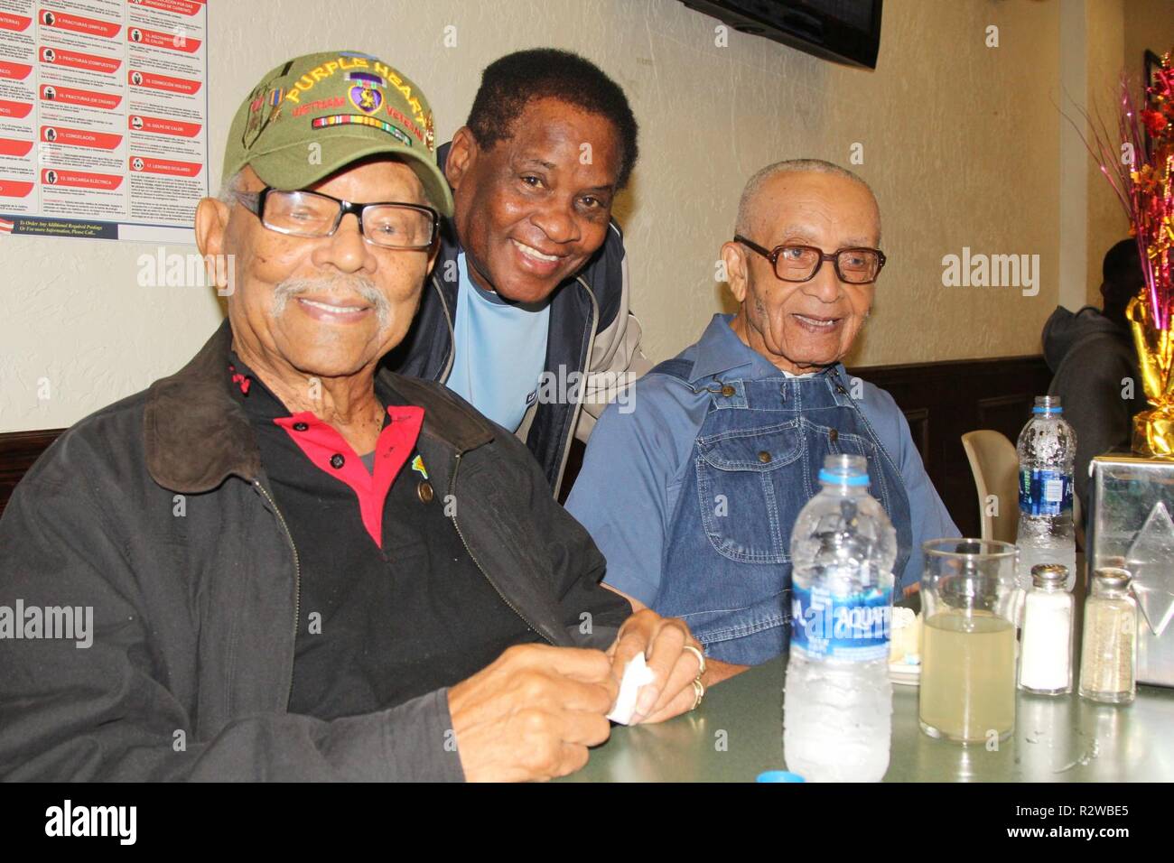 U.S. Army retired Sgt. 1st Class Howard L. Moore, left, retired Command ...