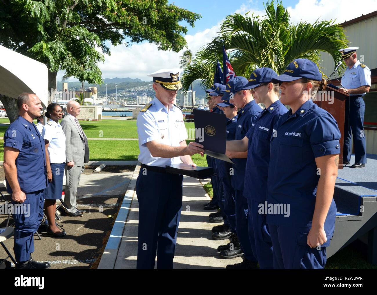 Rear Adm. Kevin Lunday, commander, Coast Guard 14th District, presents ...