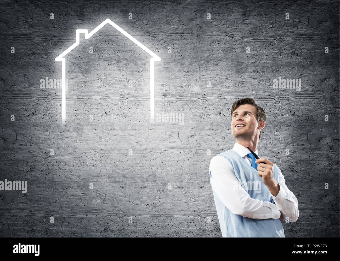 Elegant banker wearing red tie and house sign as banking concept Stock ...