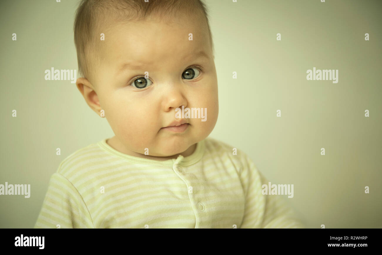 Portrait serious cute baby hi-res stock photography and images - Alamy