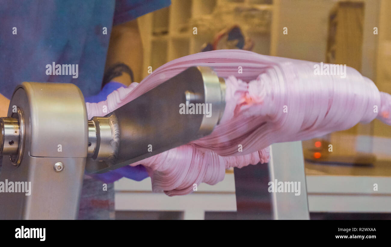 Making purple salt water taffy in small candy shop Stock Photo - Alamy