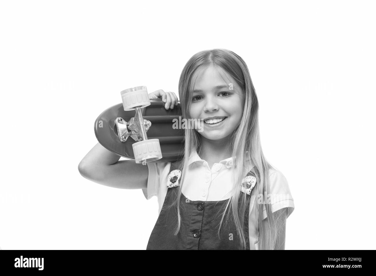 Lets ride. Girl smiling face carries penny board on shoulder isolated ...