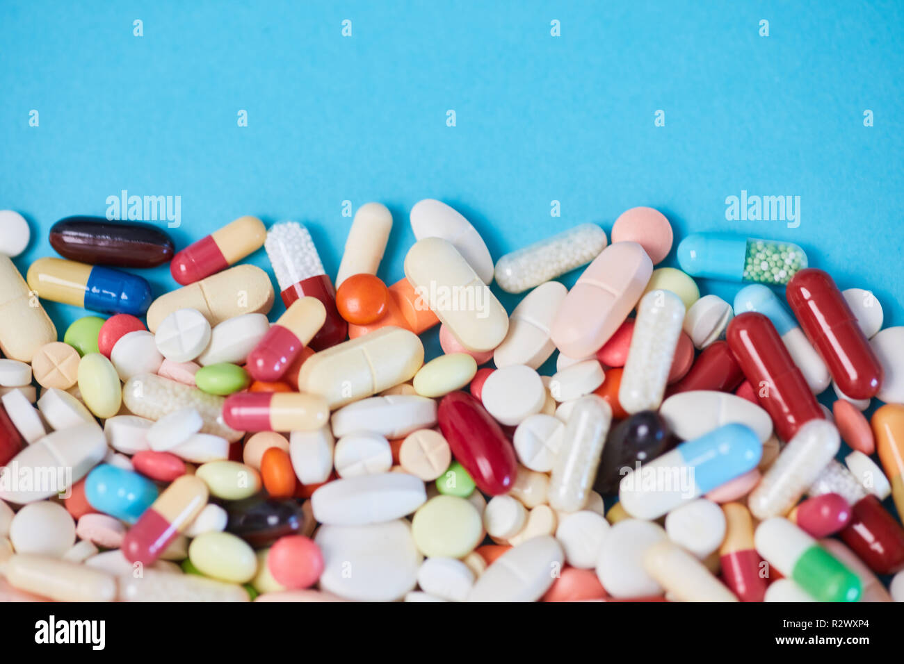Many different colorful medicines as pharmacies background with copy ...