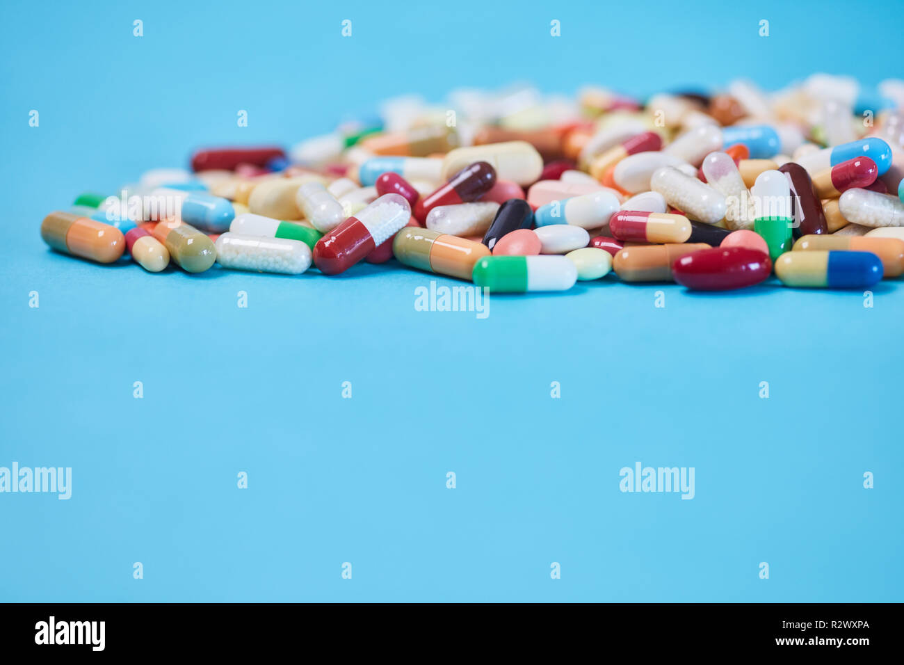 Many colorful medicines on a pile as medicine background Stock Photo ...