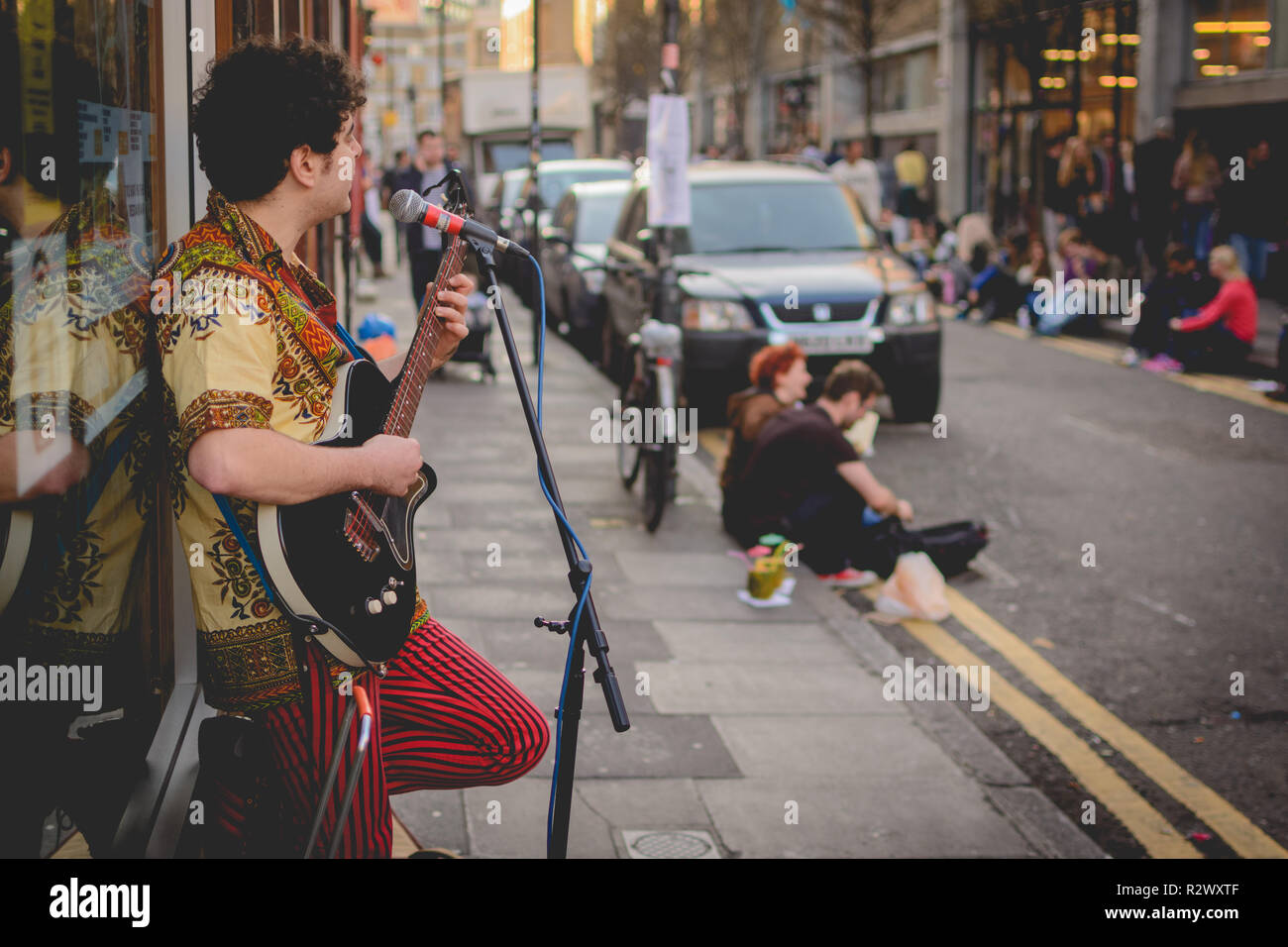 London, UK - February, 2019. Street musician playing the guitar in ...