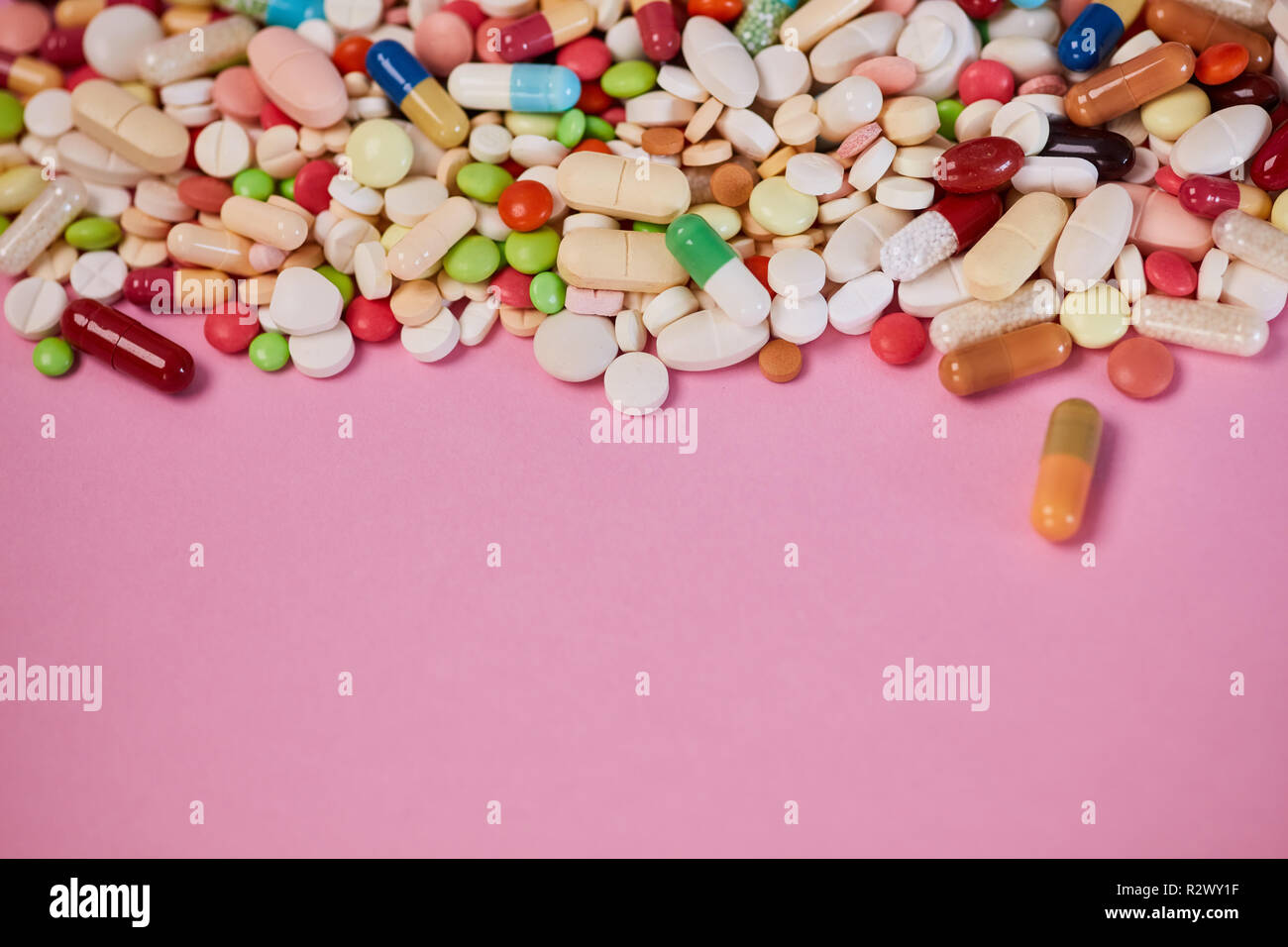 Colorful medicines and tablets as a pink background header Stock Photo ...