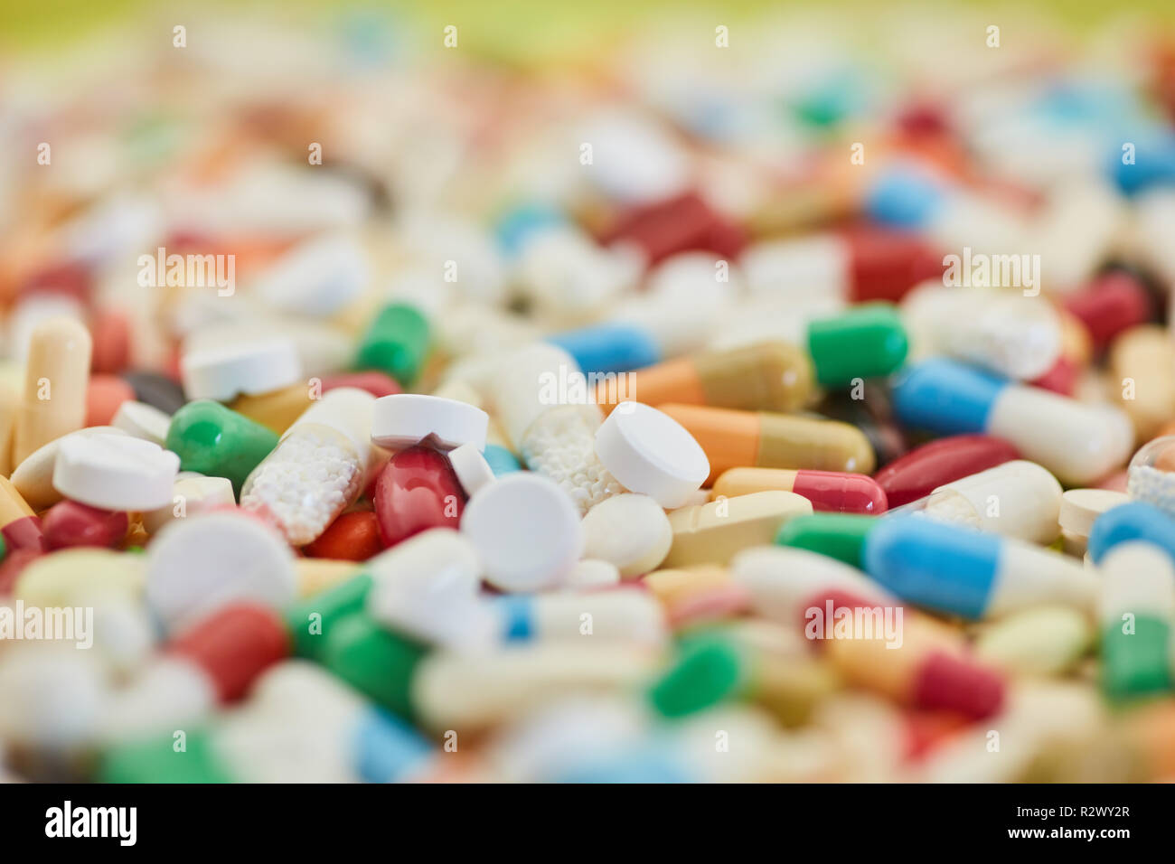 Medicine background with different colorful medicines Stock Photo - Alamy