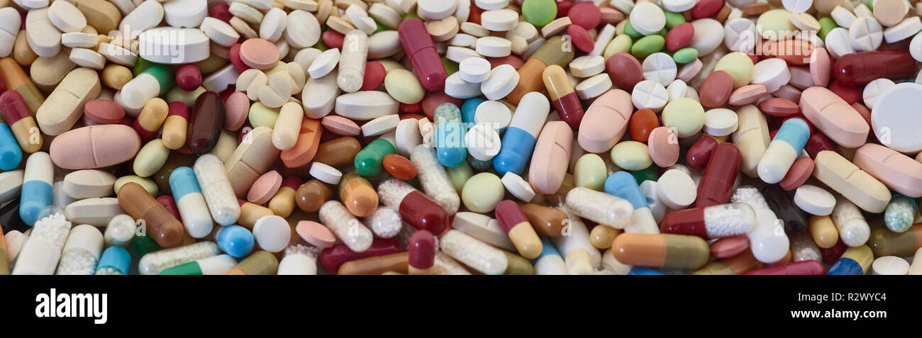 Pile of colorful medicines as a panorama header background Stock Photo ...