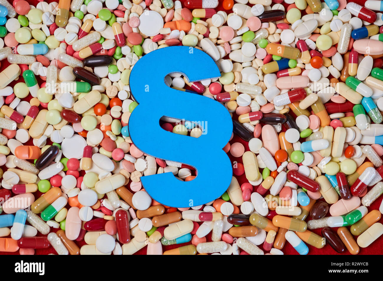 Health law concept with colorful drugs and paragraph signs Stock Photo ...