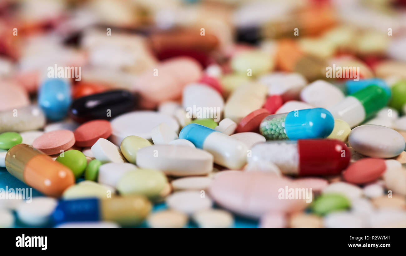 Medicine background header with many colorful medicines Stock Photo - Alamy