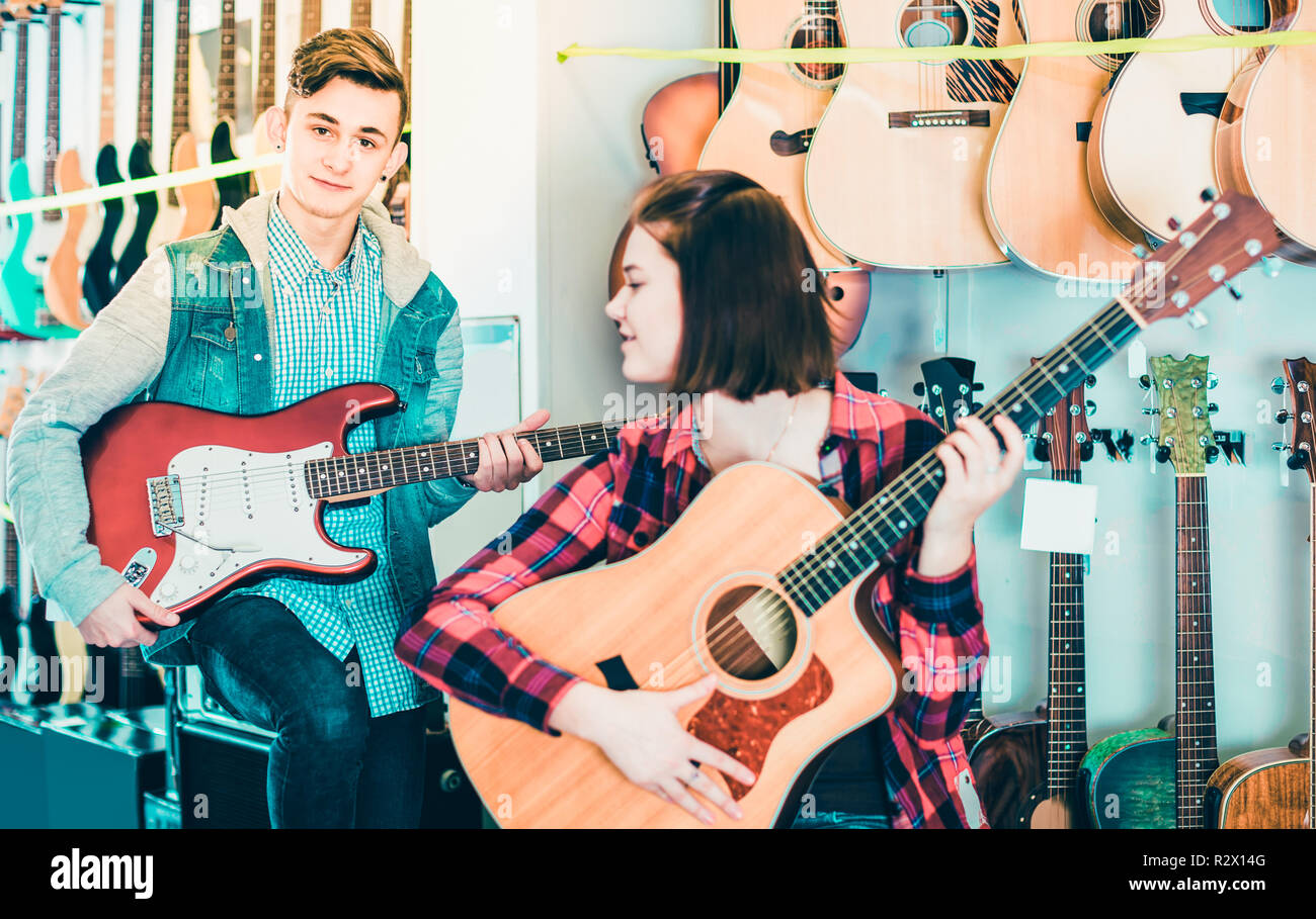 Smiling electric guitar store player hi-res stock photography and ...