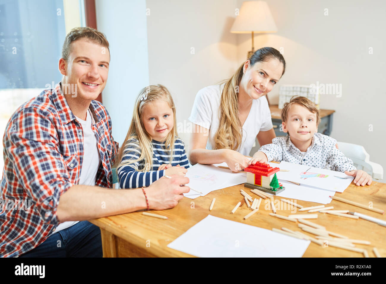 Family and children together paint their dream home dream home Stock ...