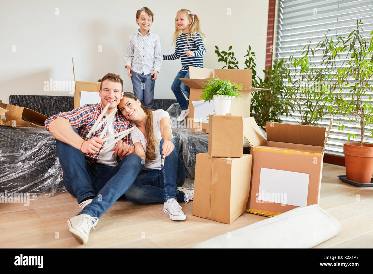 Happy family is happy about moving to new house as a home Stock Photo ...