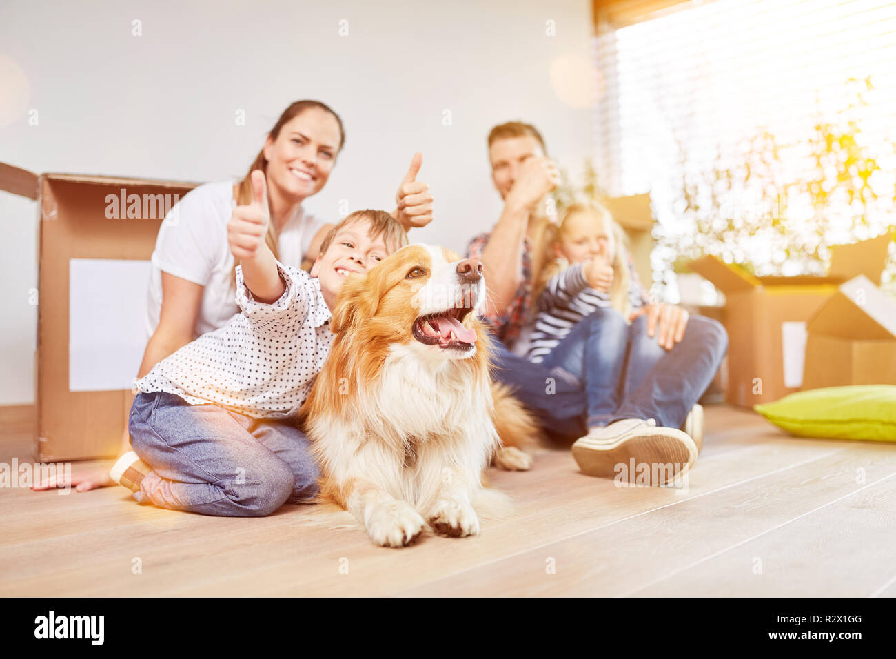 Family with two kids and dog hi-res stock photography and images - Alamy