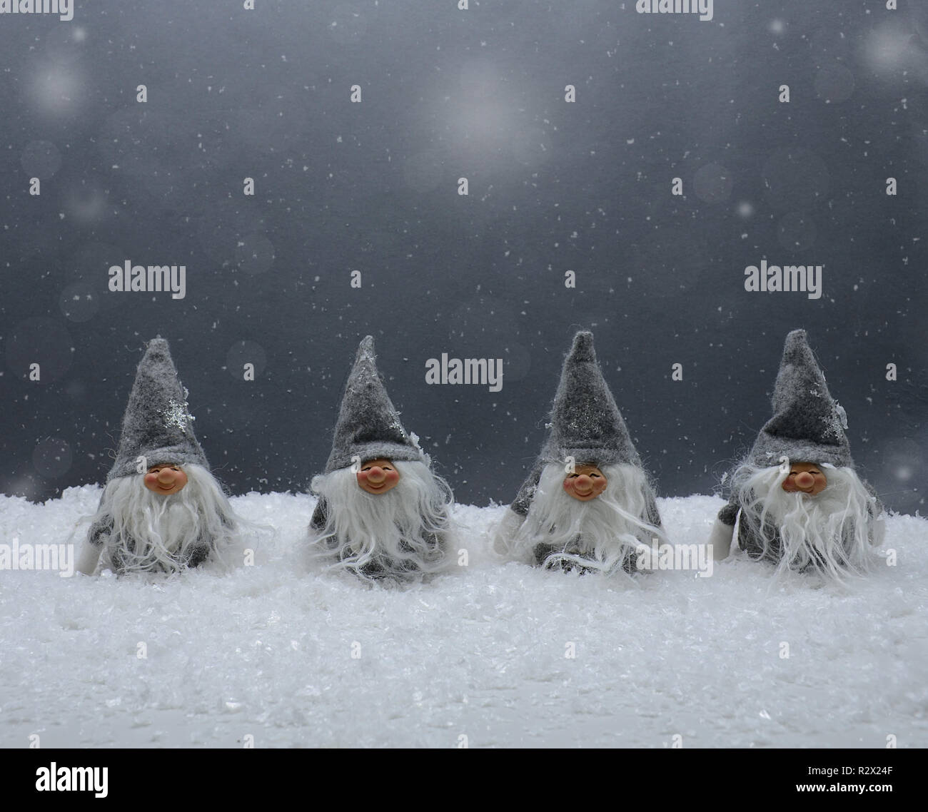 Four gnomes in the snow Christmas card Stock Photo - Alamy