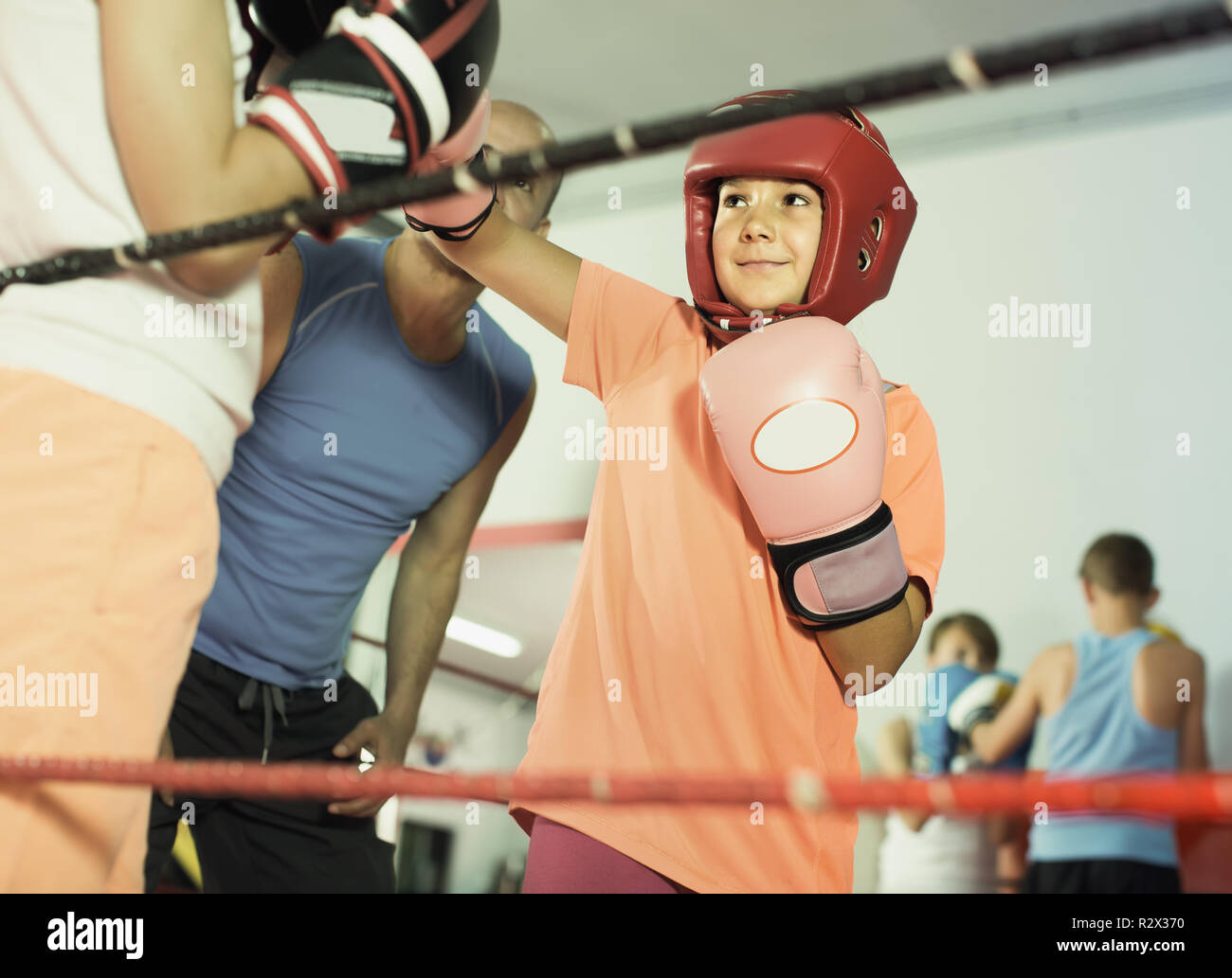 Teenagers at boxing training with coach on boxing ring Stock Photo - Alamy