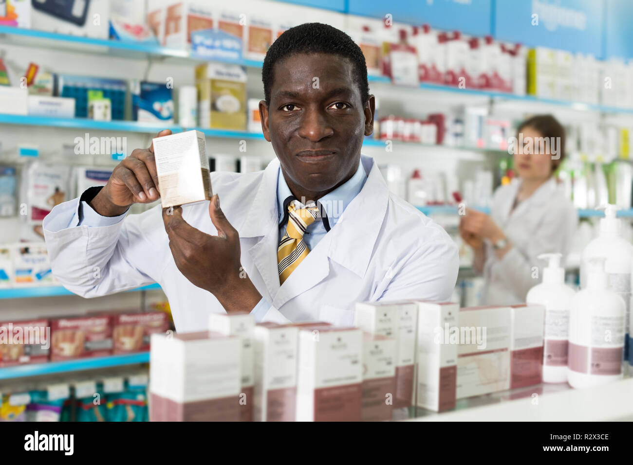 Pharmacist prescription chemist handing hi-res stock photography and ...
