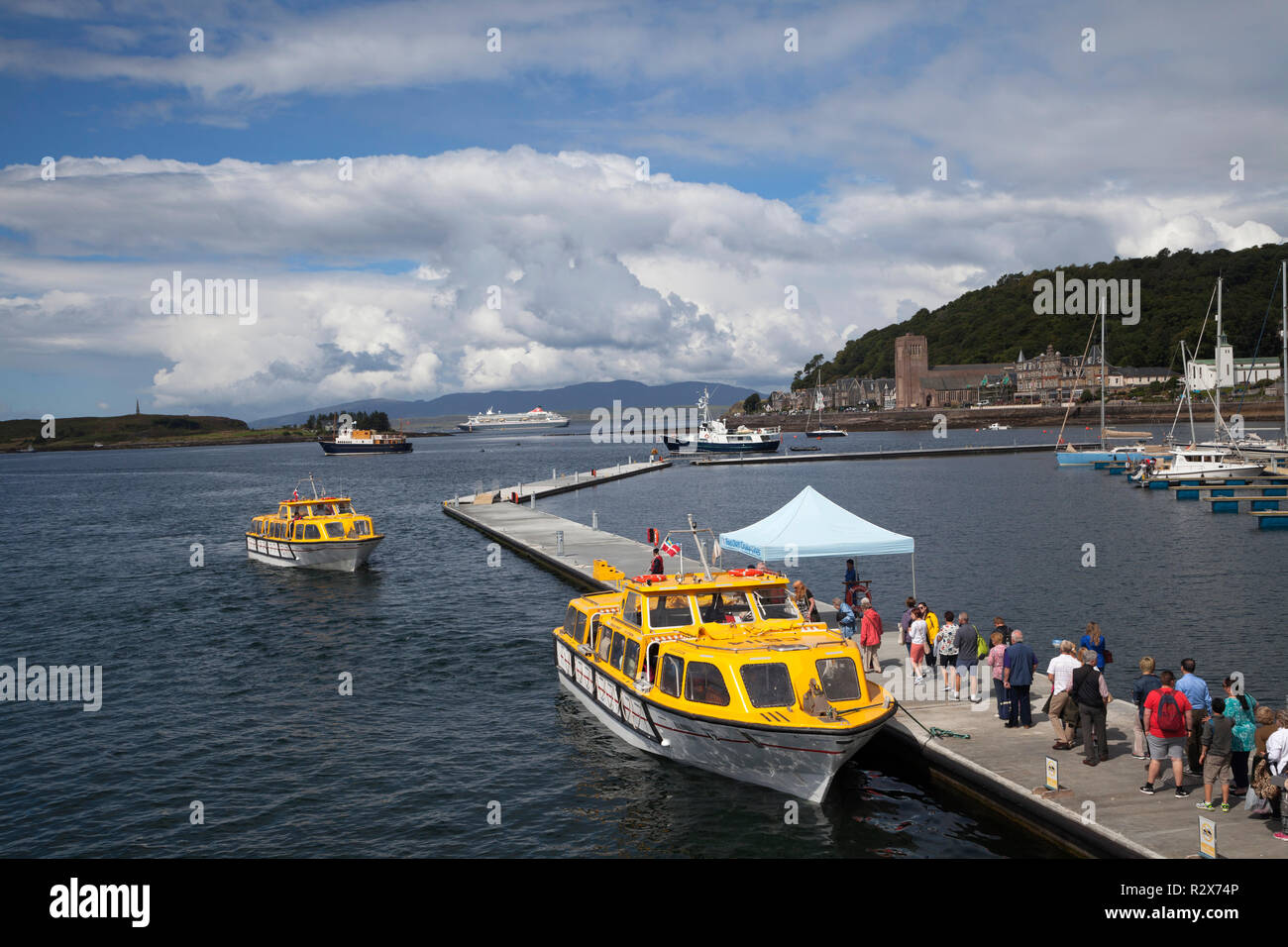 Ferries at the pontoons in Oban Bay, Argyll, Scotland taking passengers ...