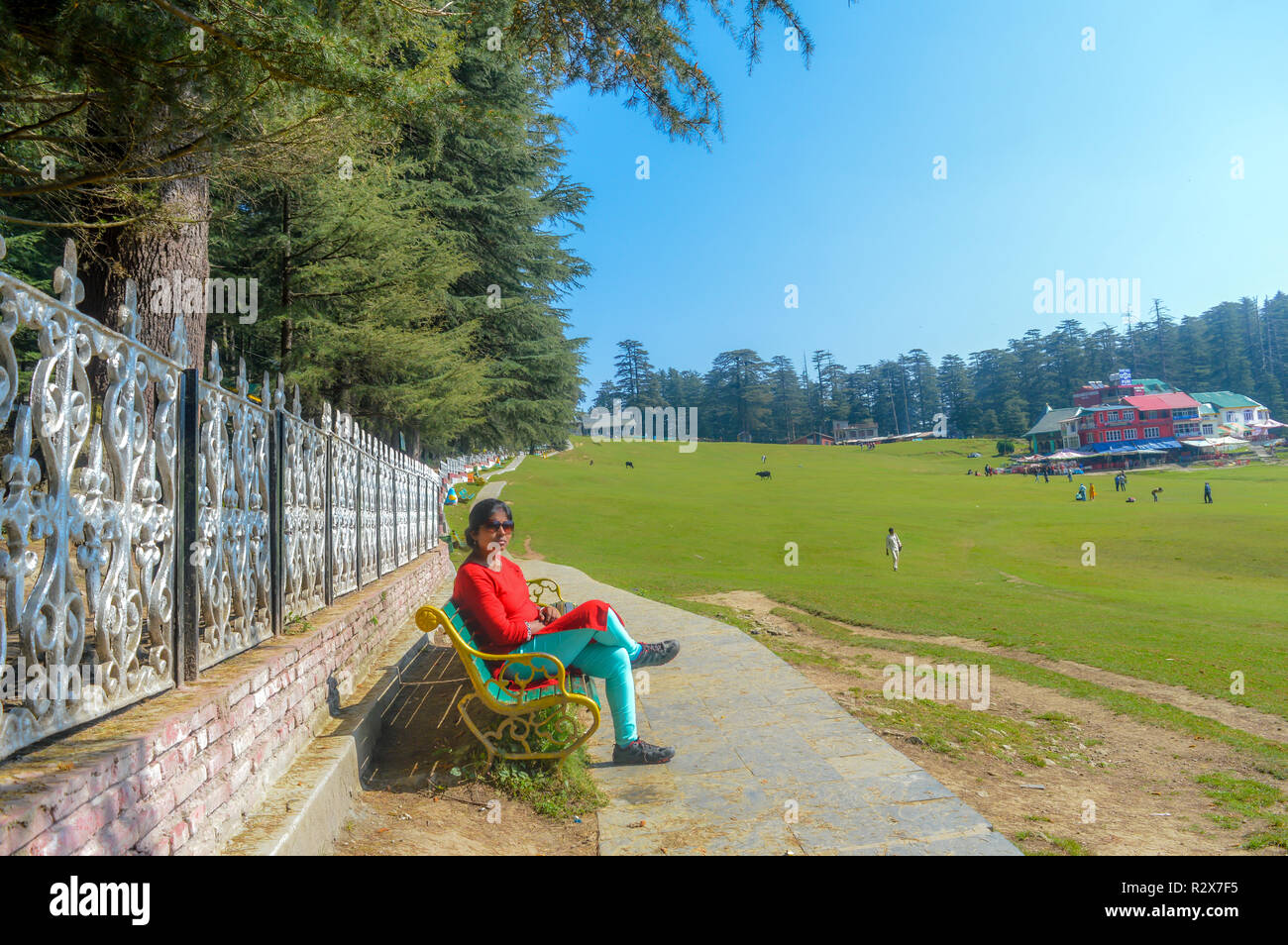 A lady sitting and relaxing on Himalayan valley of "DALHOUSIE KULLU ...