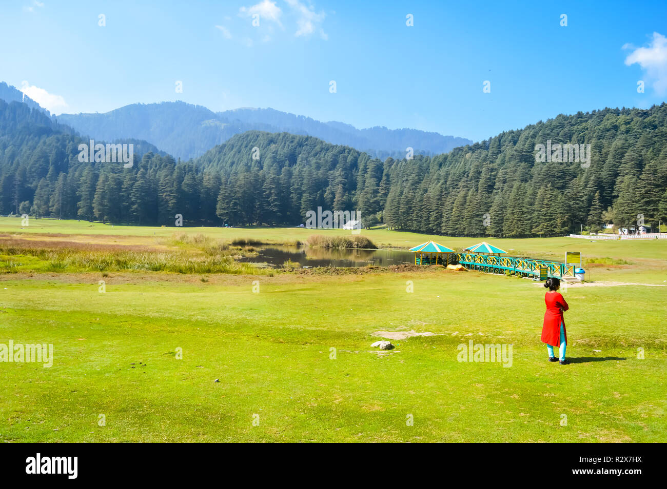 A lady standing and relaxing on Himalayan valley of "DALHOUSIE KULLU ...