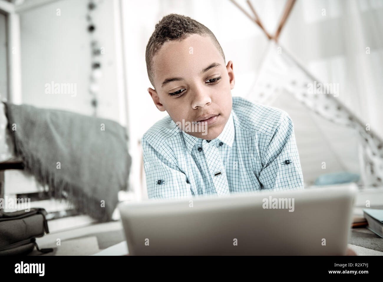 Smart cute pleasant boy using modern technology Stock Photo - Alamy