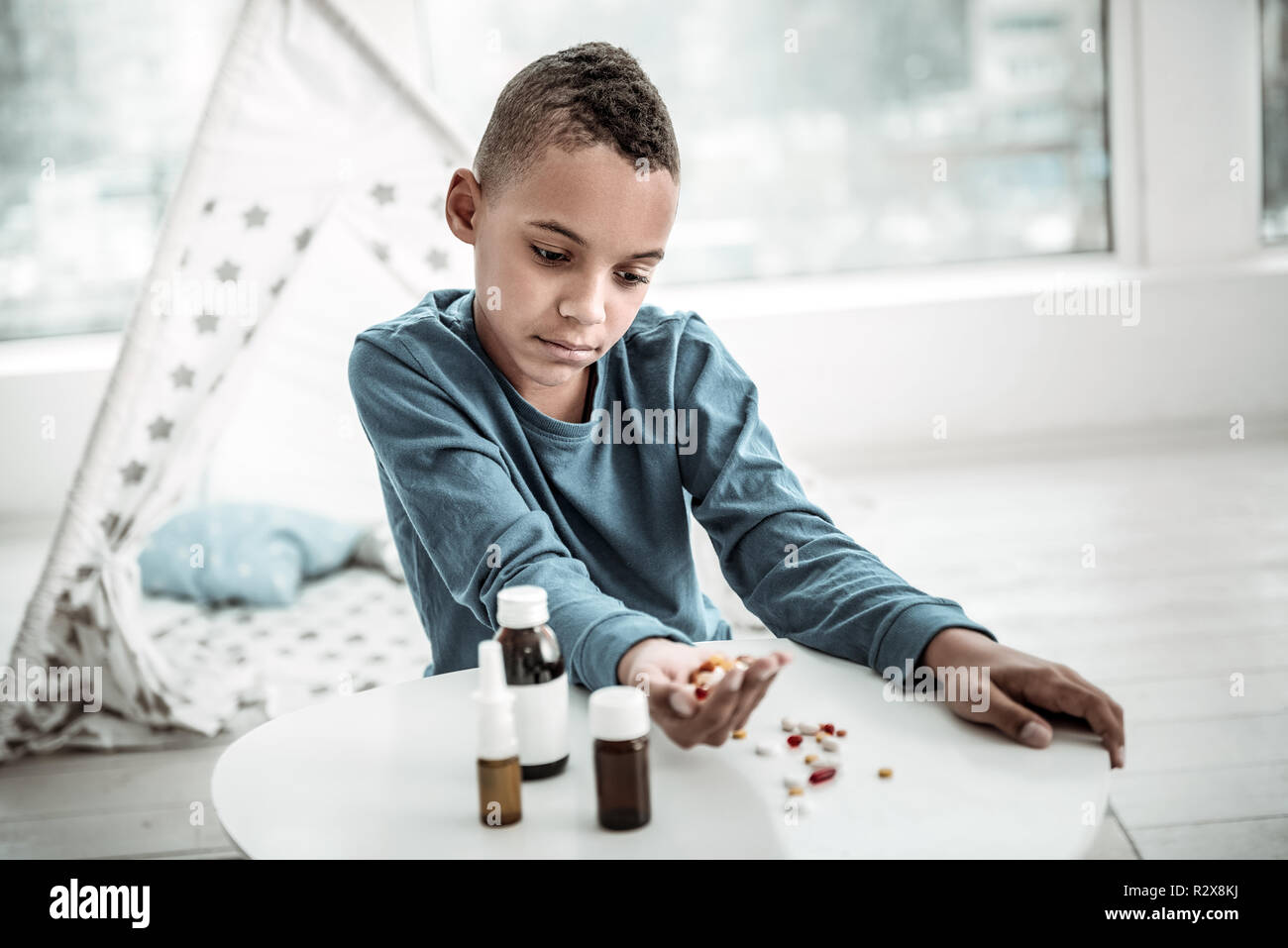 Sad depressed boy having problems with health Stock Photo - Alamy