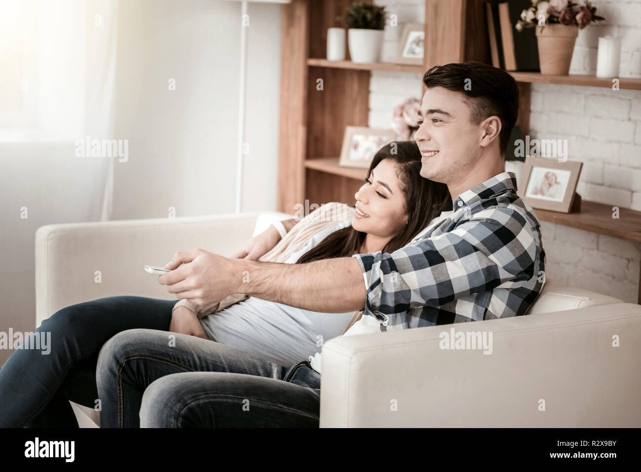 Relaxed young people having rest at home Stock Photo - Alamy