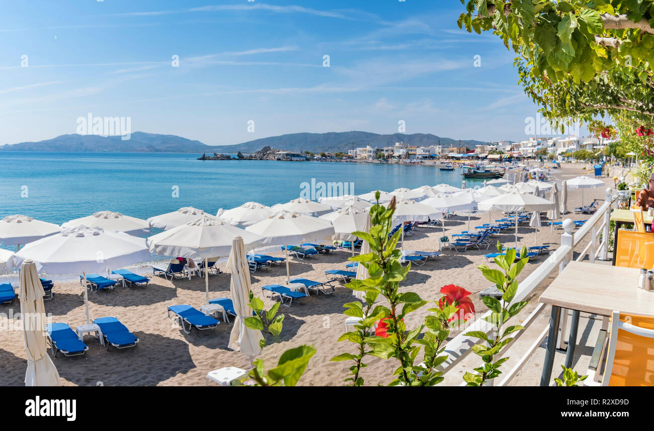 Panoramatic view of sun beds and sunshades on Haraki beach (Rhodes ...