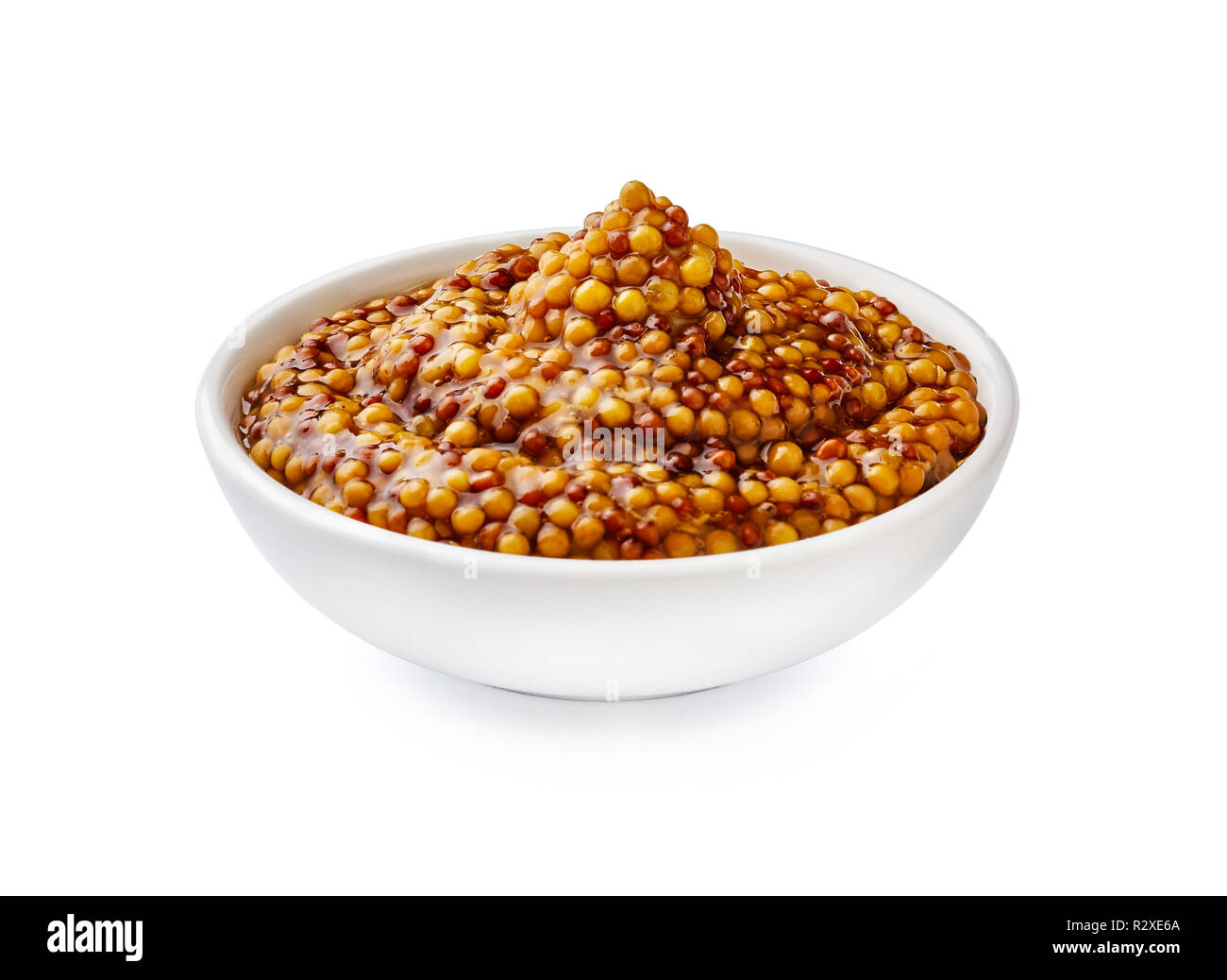 Mustard powder in bowl Cut Out Stock Images & Pictures - Alamy