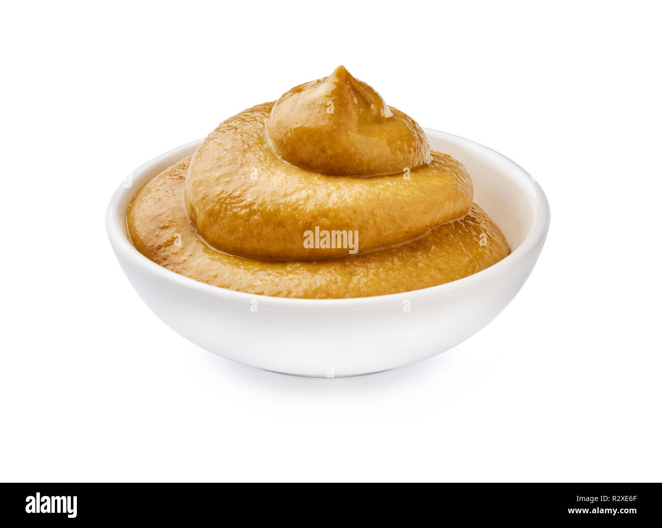 Yellow mustard in white bowl isolated Stock Photo - Alamy