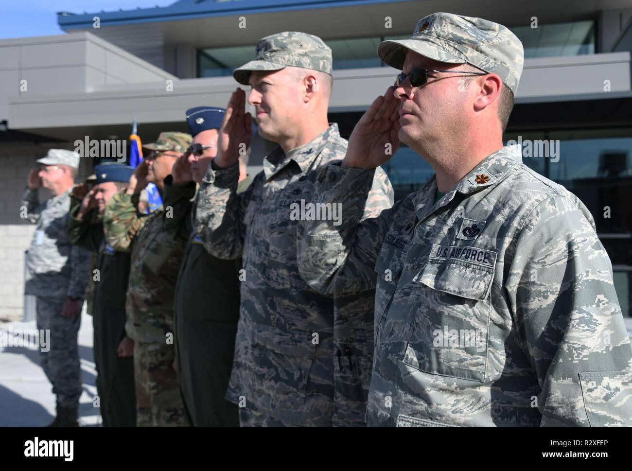 Officials from the 152nd Airlift Wing salute the flag during The ...