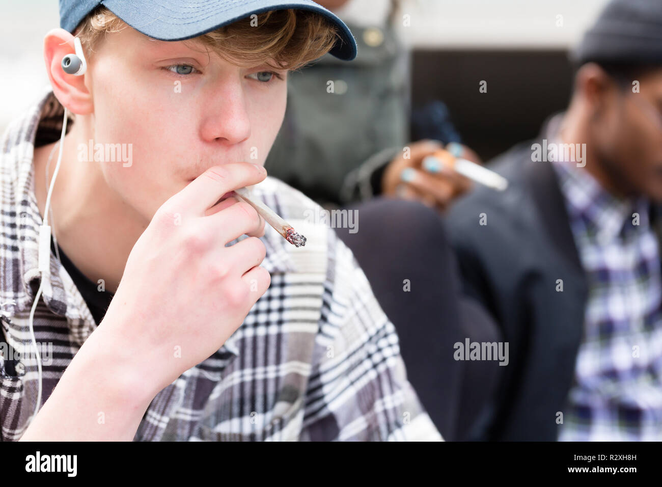 Boy smoking cigarette hi-res stock photography and images - Alamy